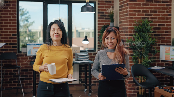 Portrait of company employees holding clipboard files Stock Photo by DC ...