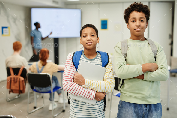 Portrait of Two Kids in School Stock Photo by seventyfourimages | PhotoDune