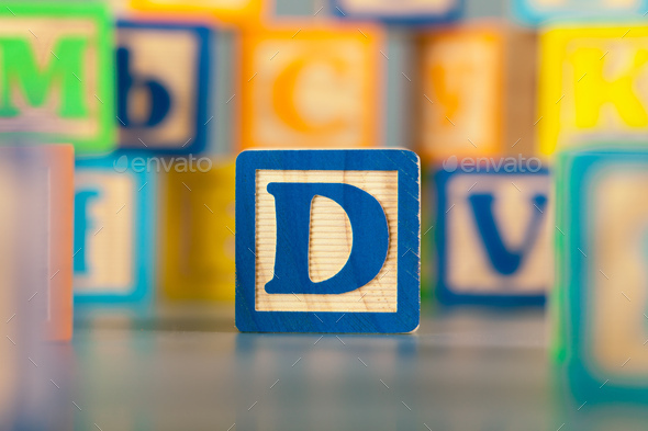Photograph of colorful Wooden Block Letter D Stock Photo by FabrikaPhoto