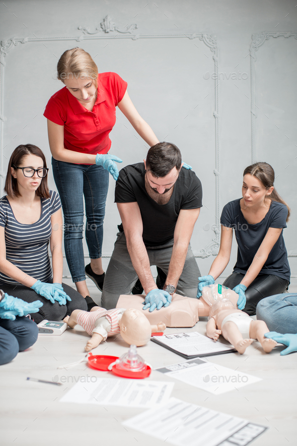 First aid training Stock Photo by RossHelen | PhotoDune