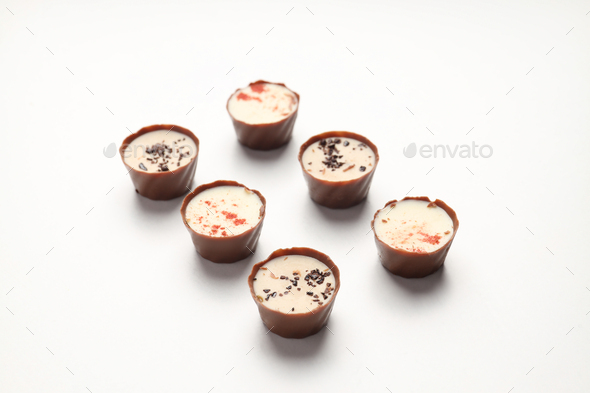 Flat lay composition with chocolate candies on white background Stock ...
