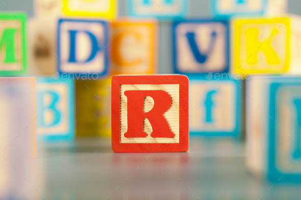 Photograph of colorful Wooden Block Letter R Stock Photo by FabrikaPhoto