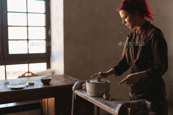 Young woman sculptor artist creating a bust sculpture Stock Photo by ...