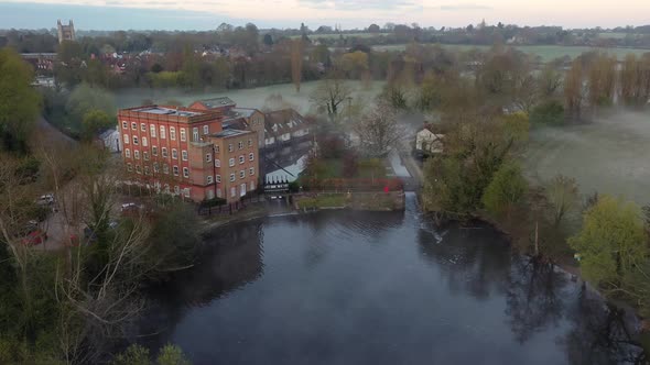 Drone footage over Dedham Mill at sunrise towards Dedham., Stock Footage