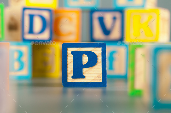 Photograph of colorful Wooden Block Letter P Stock Photo by FabrikaPhoto