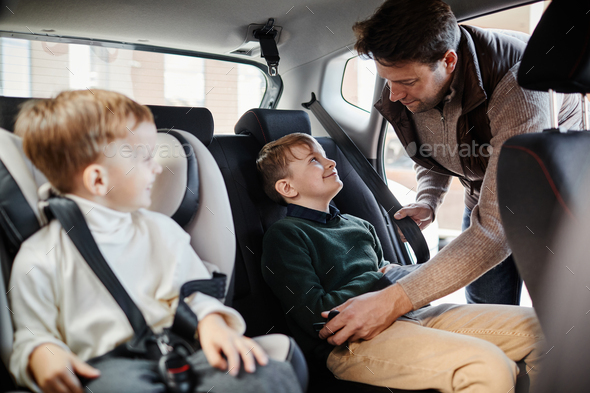 Children in Back Seat Stock Photo by seventyfourimages | PhotoDune