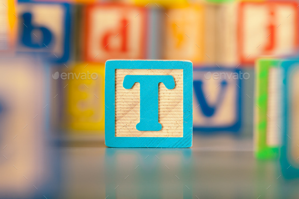 Photograph of colorful Wooden Block Letter T Stock Photo by FabrikaPhoto