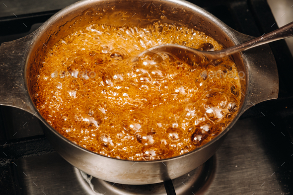 Preparation of sugar candies at home.A taste of our childhood.Rooster ...
