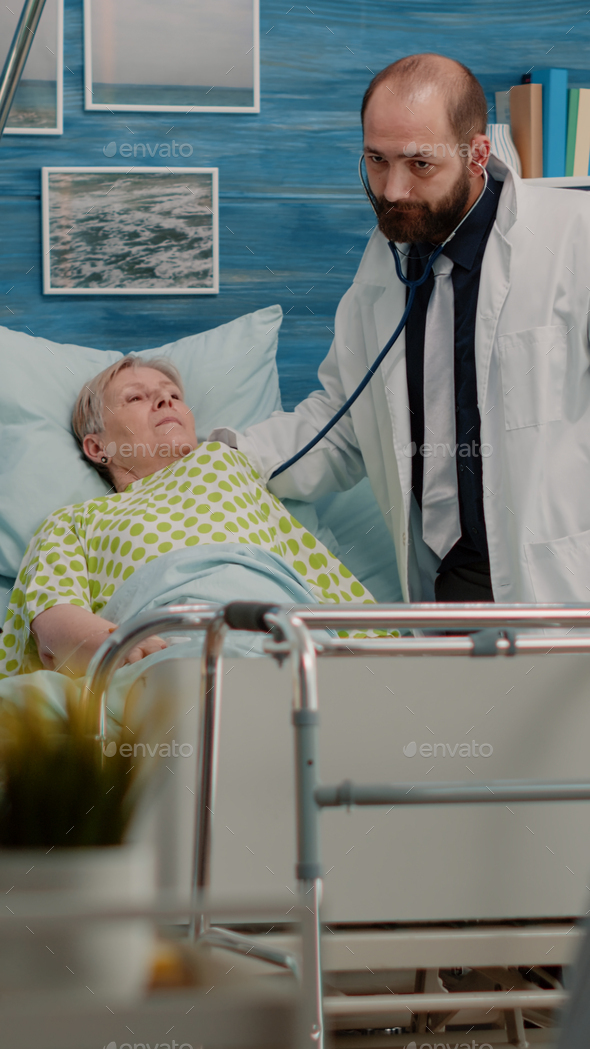 Old patient with disease receiving consultation from medical team Stock ...