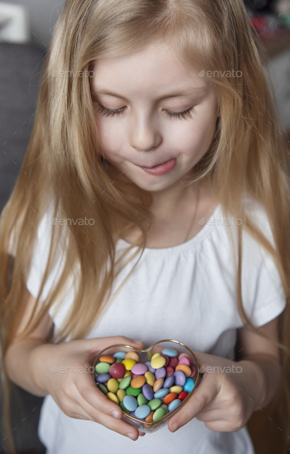 Child holding candy, jelly in hand Stock Photo by Olena_Rudo | PhotoDune