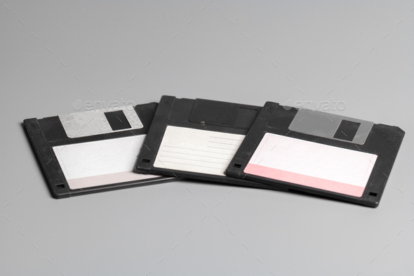 Three old computer diskette over grey background Stock Photo by ...