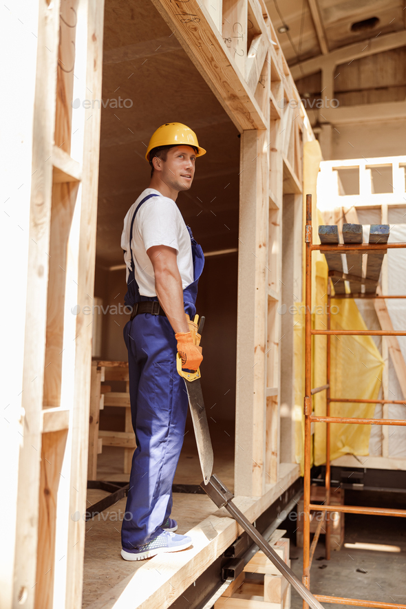 Handsome man builder standing in construction cabin Stock Photo by ...
