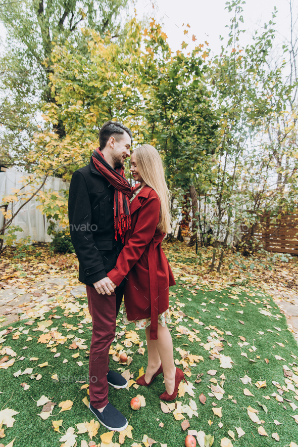 Full length view of the smiling couple in love hugging and bonding to ...