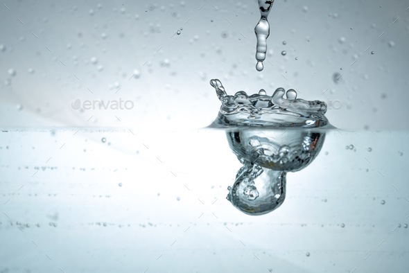 Jet of water forms small water vortex with funnel shape Stock Photo by ...