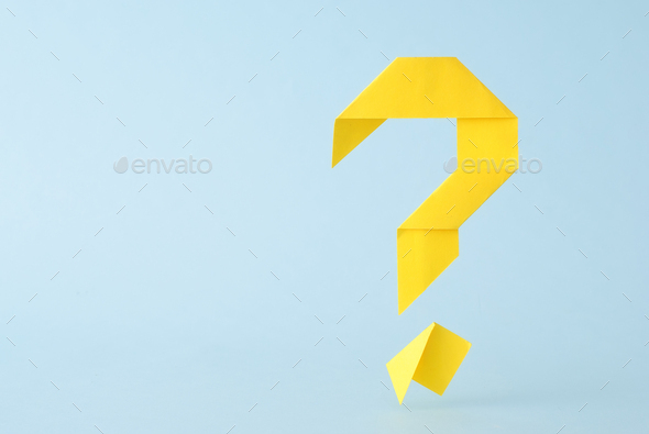 Folded yellow paper origami question mark on blue Stock Photo by sergign