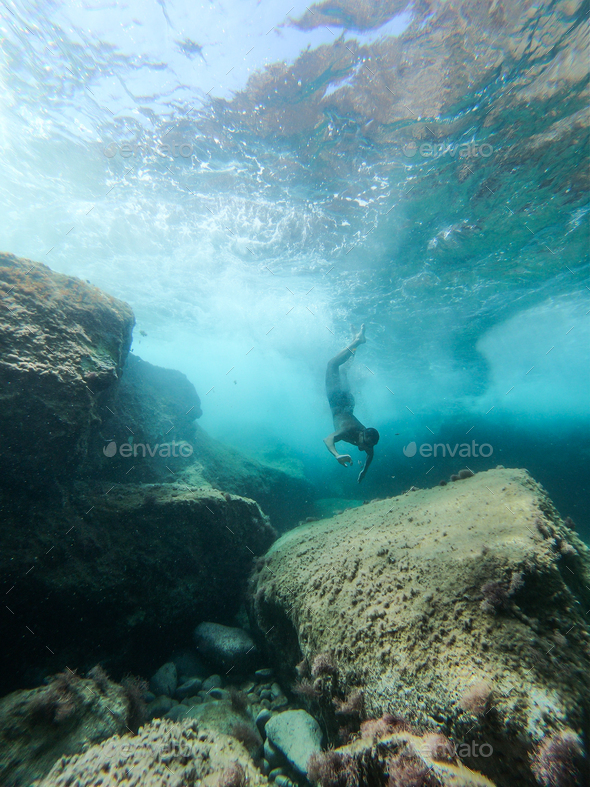 Woman diving into the sea. Stock Photo by ivanmorenosl | PhotoDune