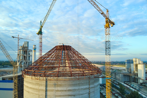 Aerial view of cement factory under construction with high concrete ...