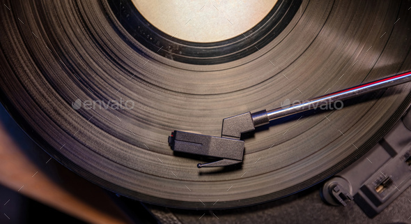 Turntable vinyl record player. Needle on the disc, close up top view ...