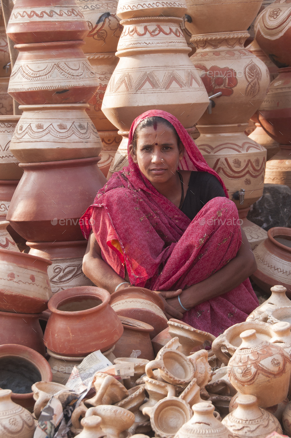 Woman selling earthen pots by the roadside at village of India. Stock ...