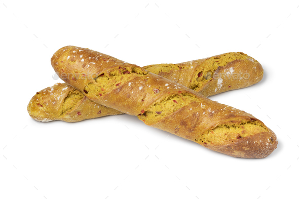 Pair of fresh baked homemade baguette with curry and tomato seasoning ...