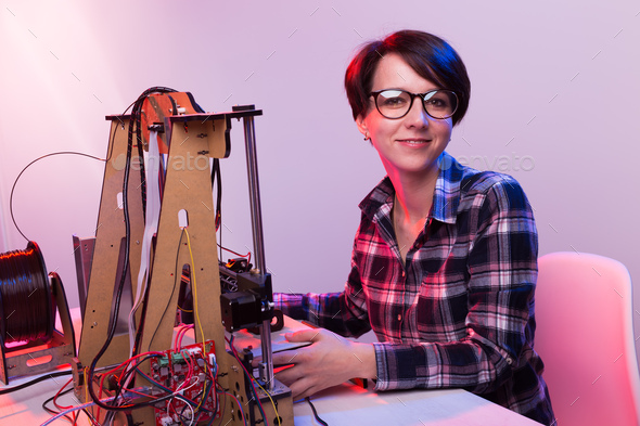 A student woman print prototype on 3D printer Stock Photo by Satura_