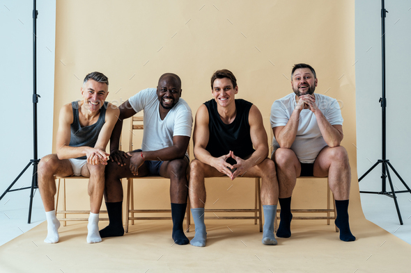 Group of multiethnic men posing for a male edition body positive beauty ...