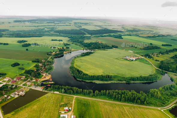 view from the height of the Lake in a green field in the form of a ...