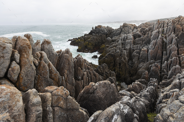 Jagged rocks and the rocky coastline of the Atlantic at De Kelders ...