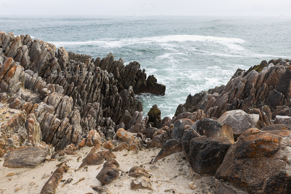 Jagged rocks and the rocky coastline of the Atlantic at De Kelders ...