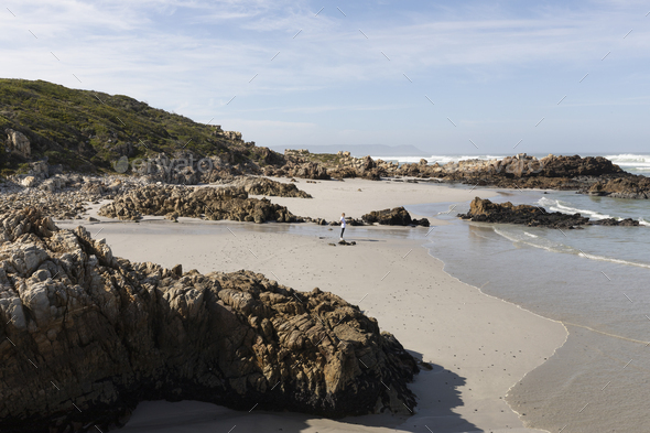 View over a sandy beach and rock formations on the Atlantic coastline ...