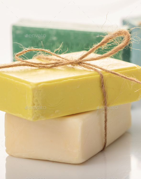 Handmade soap bars on white background. Vertical. Stock Photo by rawf8