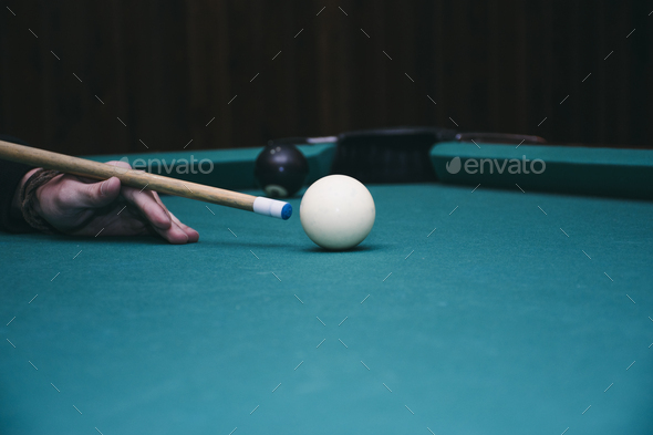 Hand of a man playing pool billard in a bar Stock Photo by westend61