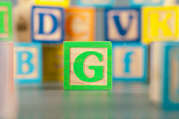 Photograph of colorful Wooden Block Letter G Stock Photo by FabrikaPhoto