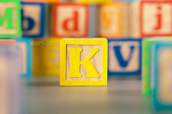 Photograph of colorful Wooden Block Letter K Stock Photo by FabrikaPhoto