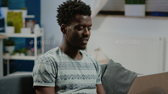 Close up of black person typing on laptop keyboard Stock Photo by DC_Studio