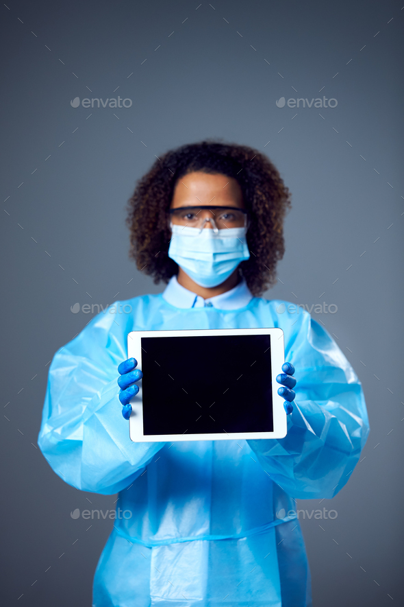 Studio Portrait Of Female Lab Worker in PPE With Face Mask And Safety ...