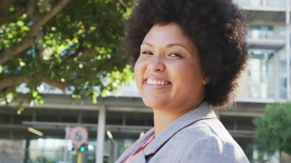 Portrait of happy plus size biracial woman in city, Stock Footage ...