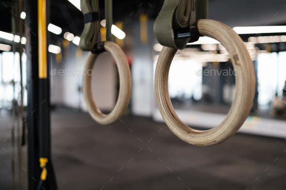 Close up gymnastic rings hang in gym. Stock Photo by borodai | PhotoDune