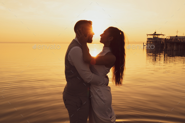 Lovers looking with love to each other at sunset Stock Photo by Pasanheco