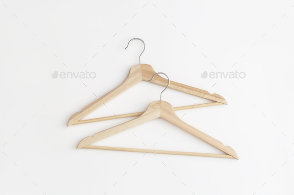 Wooden hangers on white background. Top view. Flat lay.Wooden hangers ...