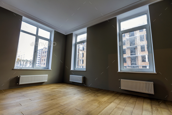 New renovated room interior with big windows, heating radiators Stock ...