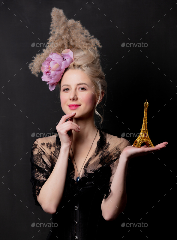 Beautiful blonde countess with the Eiffel tower statuette Stock Photo ...