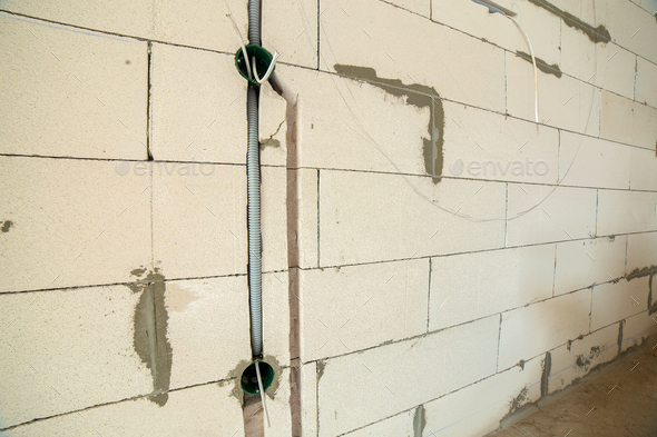 New electrical wiring installation, plastic boxes and electrical cables ...