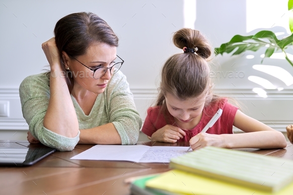Mother and daughter child study together at home Stock Photo by ...