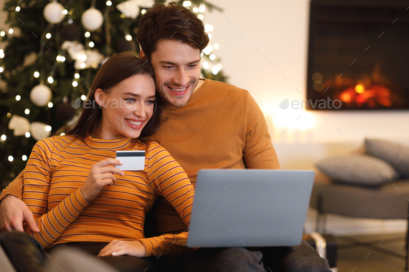 happy couple using pc and debit credit card at home Stock Photo by ...