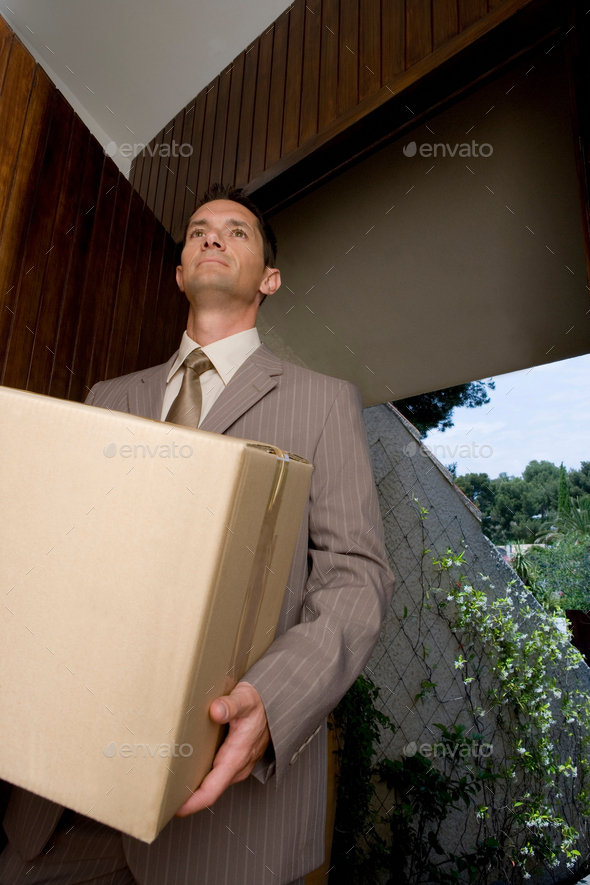 business man moving in a new house Stock Photo by nualaimages | PhotoDune