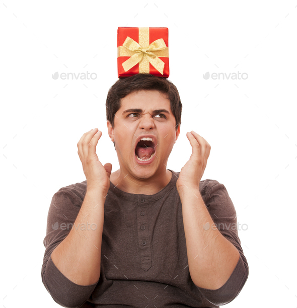 An angry man holding present box on white background. Stock Photo by ...