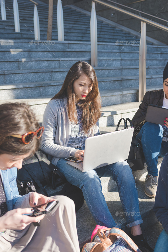 Multiracial group young people using technology Stock Photo by peus80