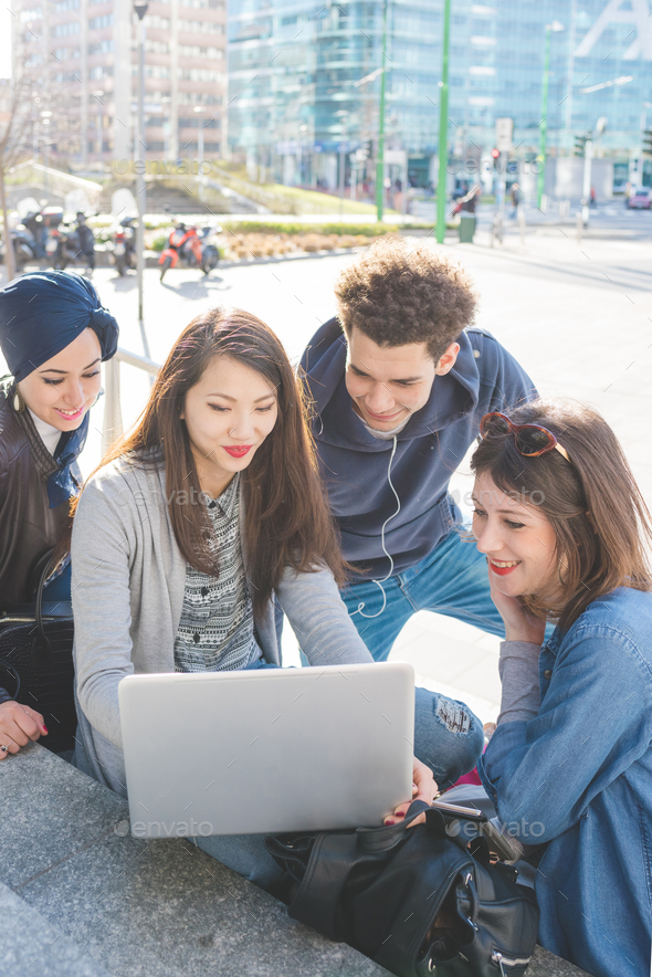 Multiracial group young people using technology Stock Photo by peus80