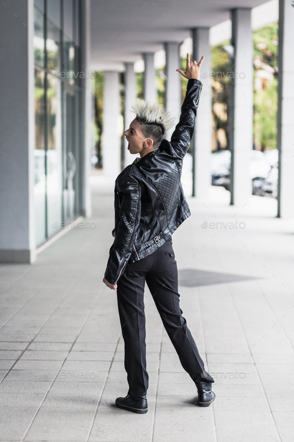 Rear view of screaming punk woman at an arcade Stock Photo by westend61
